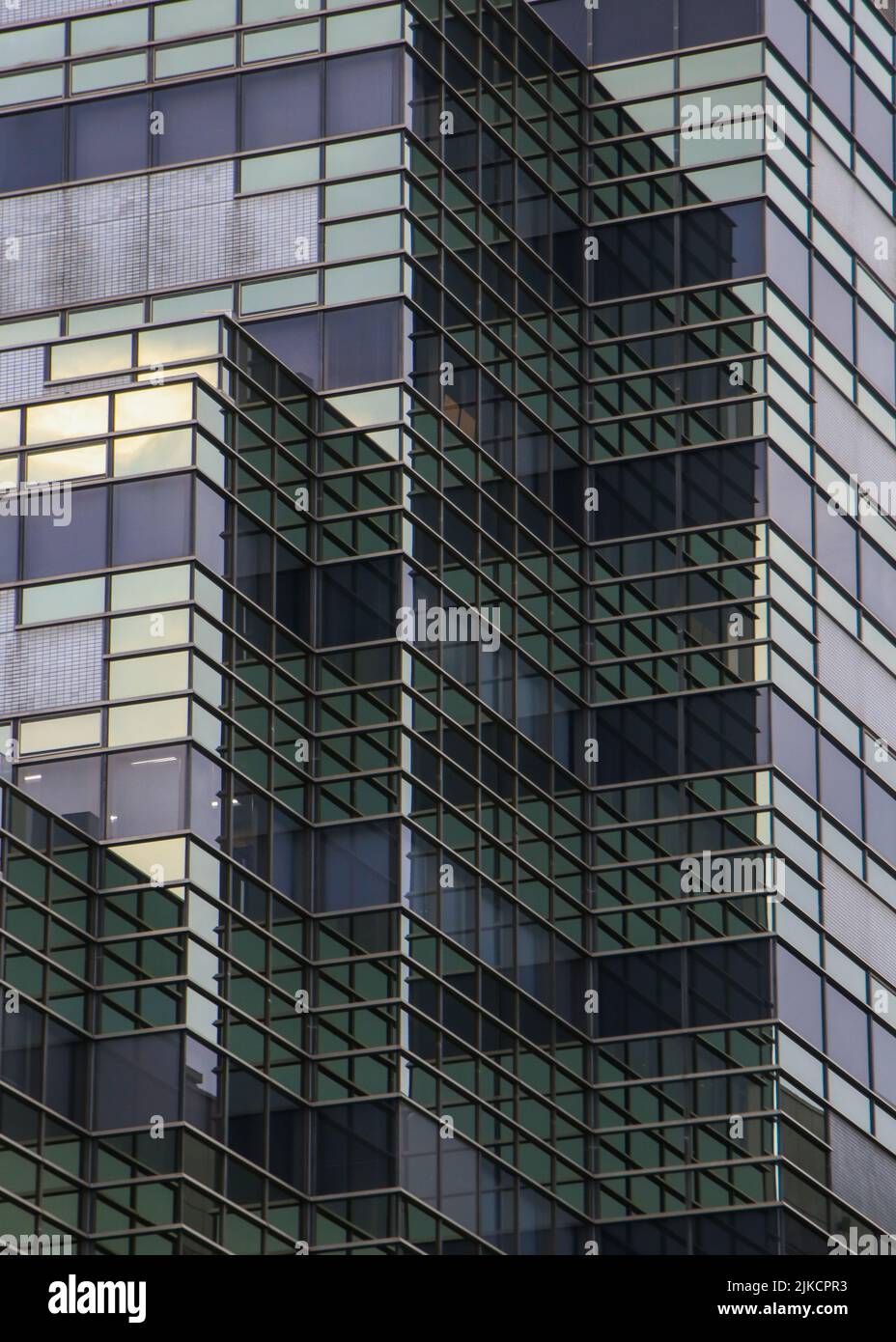 A vertical closeup of modern skyscraper made with glass Stock Photo - Alamy