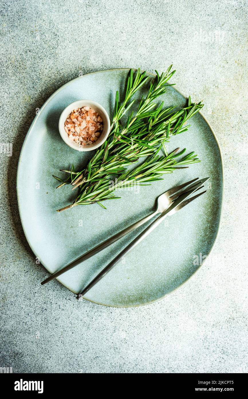 Table setting with fresh rosemary Stock Photo - Alamy