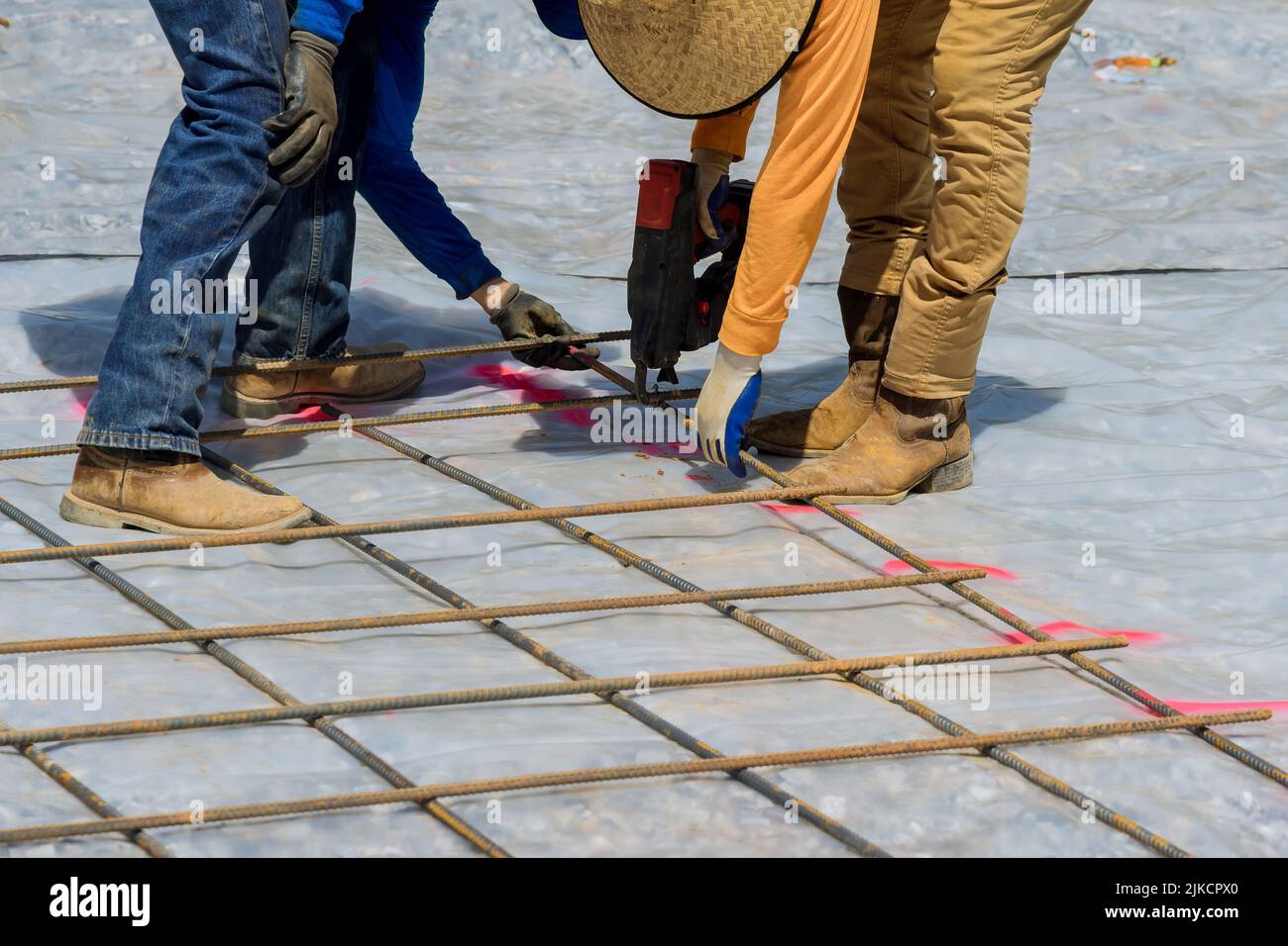 As part of the cement foundation construction process, a construction ...