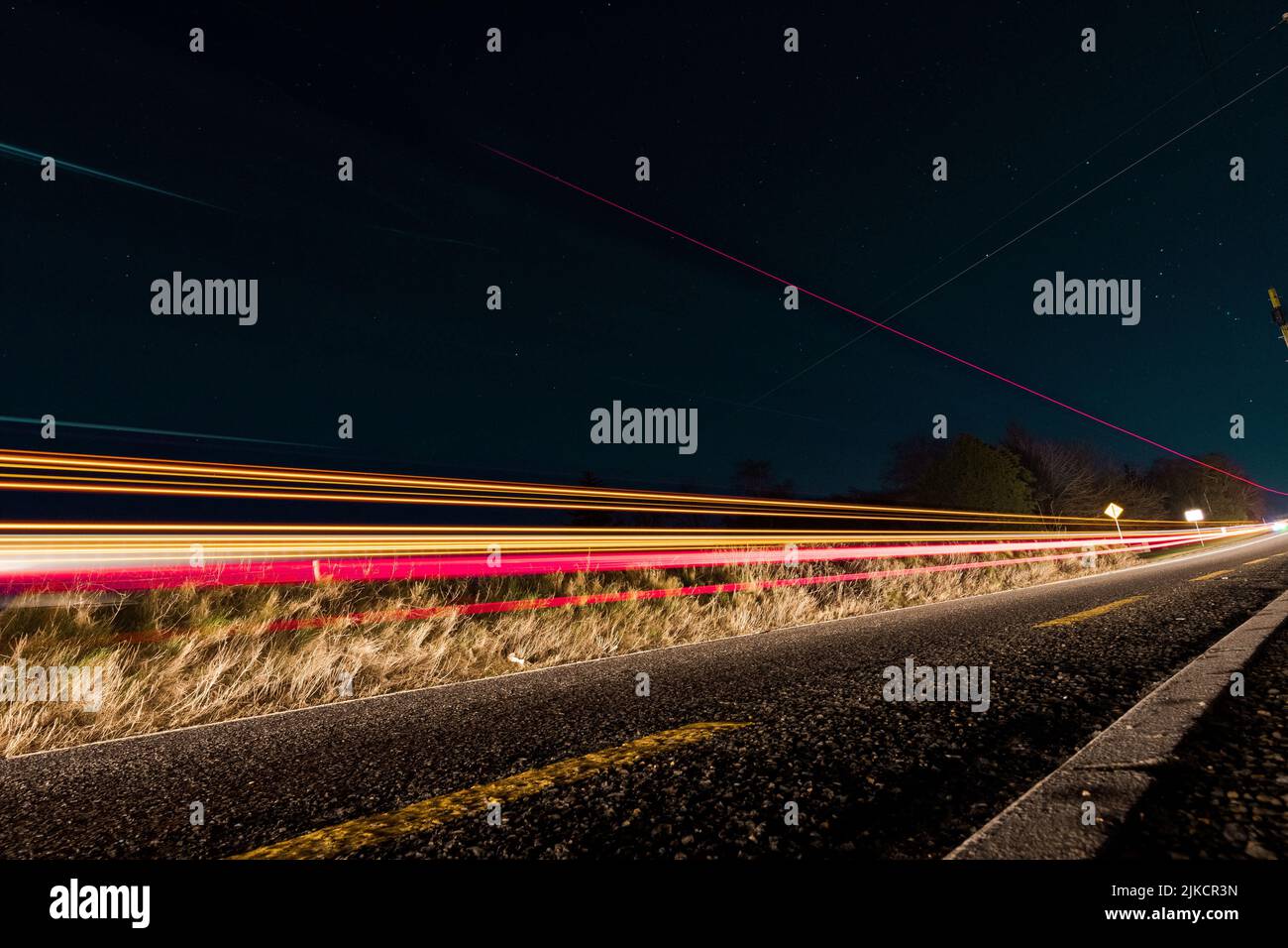 A low angle of traffic lights at night shot in long exposure Stock ...