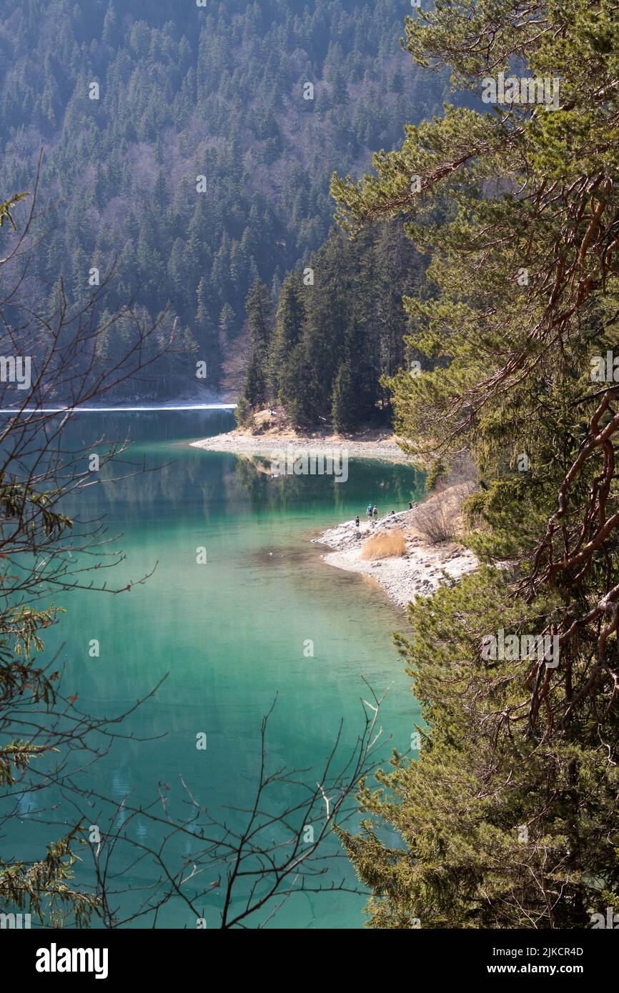Lake Eibsee with turquoise color and small island near Wetterstein in ...