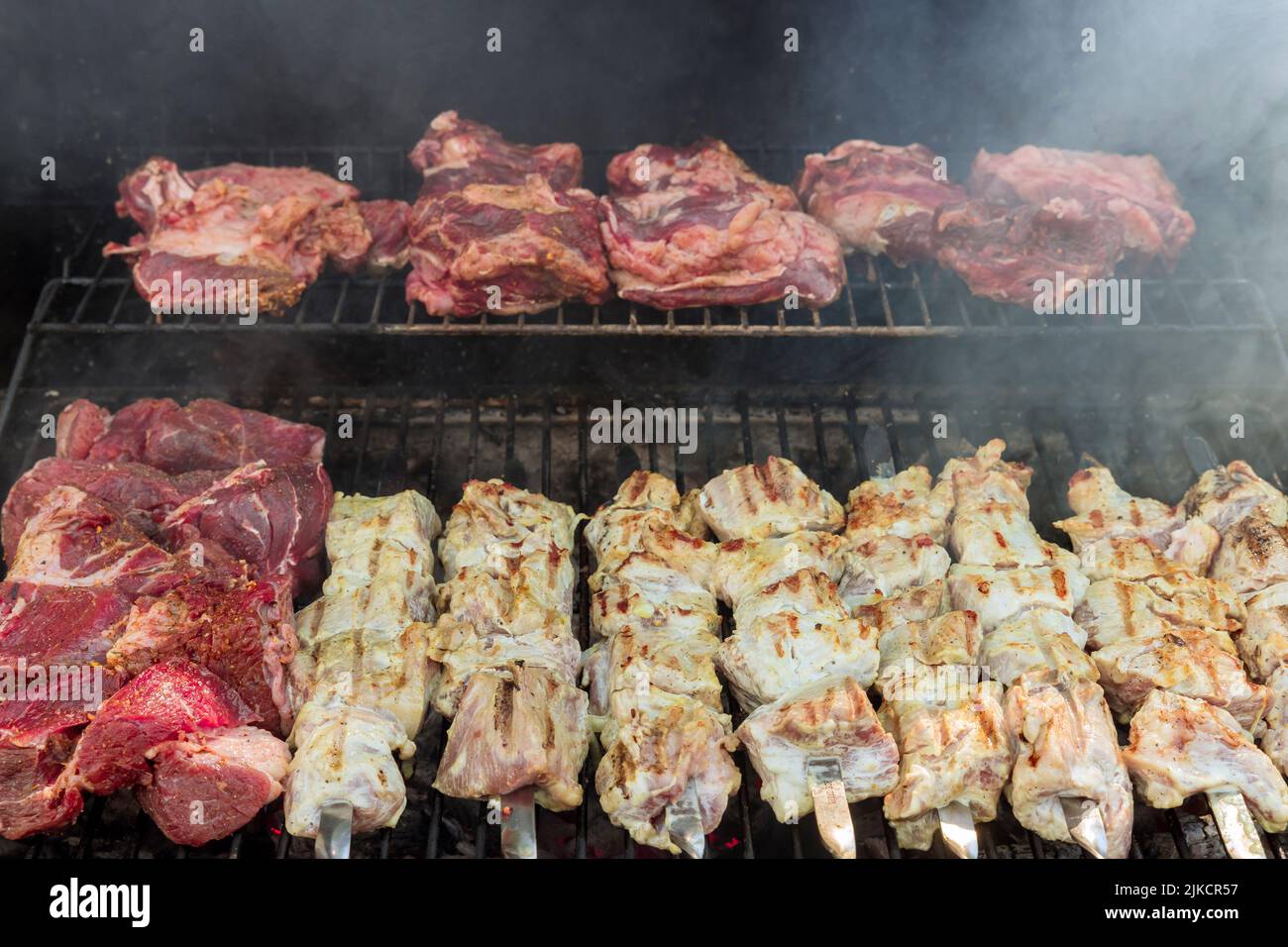 BBQ grilled skewers of beef meat with a shish kebab grill of delicious ...