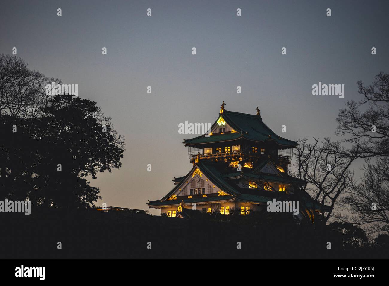 An evening view of the famous Osaka Castle, a UNESCO world heritage ...