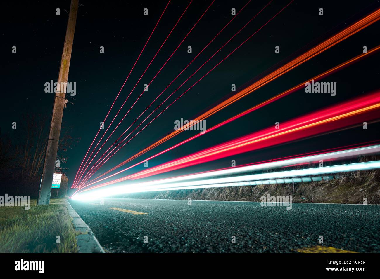 A low angle of traffic lights at night shot in long exposure Stock ...
