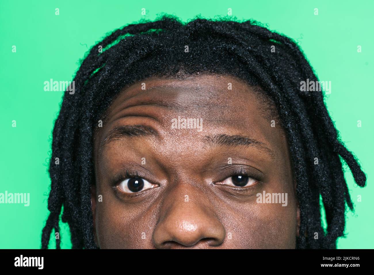 Young black perplexed man posing and looking at camera isolated over ...