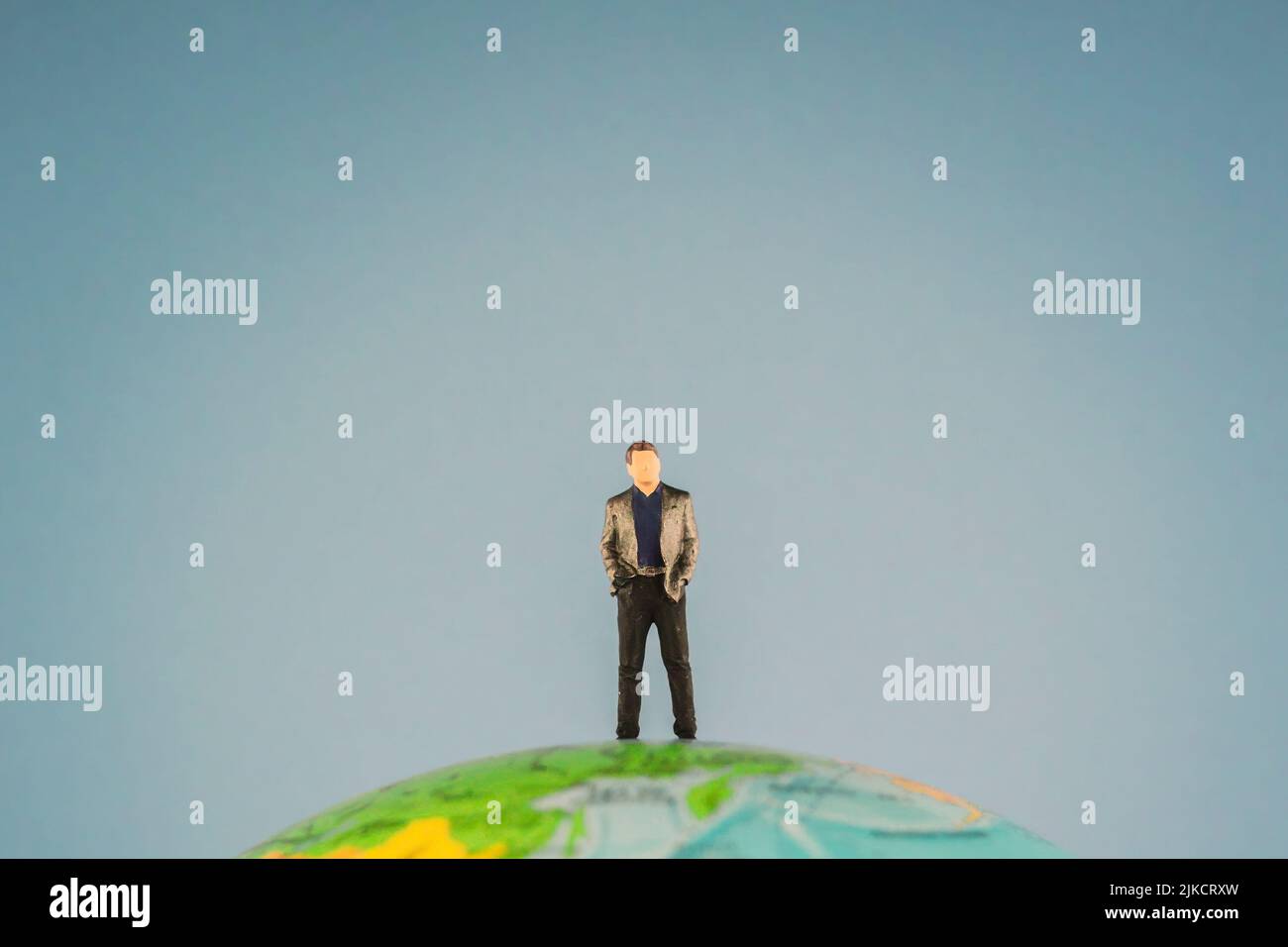 Man standing on top globe hi-res stock photography and images - Alamy