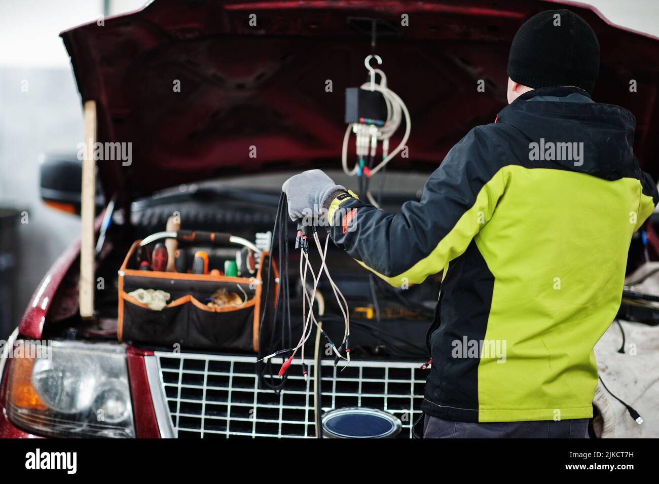 Auto mechanic sets american SUV car for diagnostics and configuration ...
