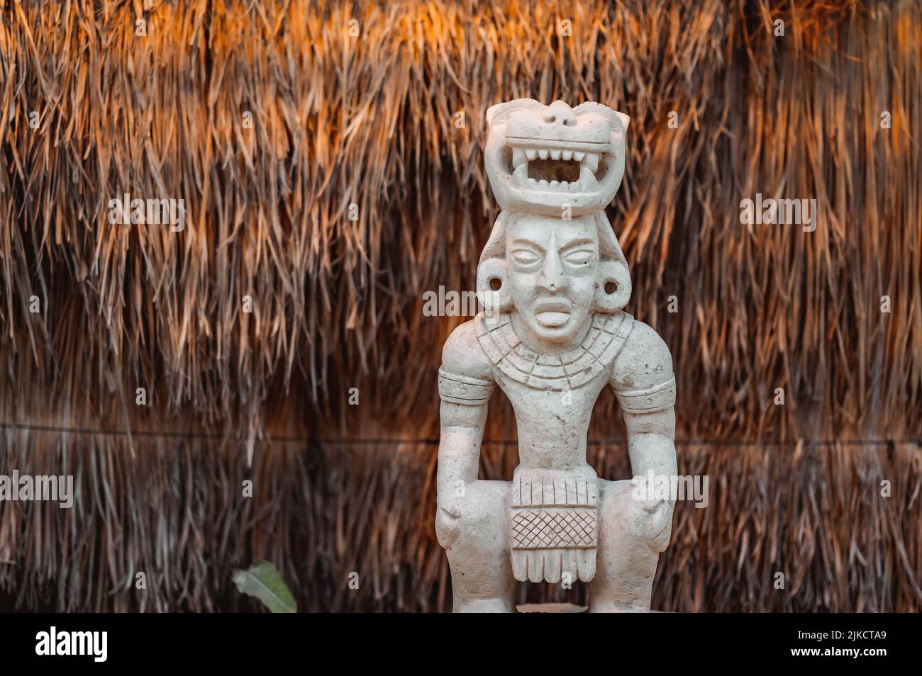A white Cocijo deity sculpture in Tulum, Mexico Stock Photo - Alamy