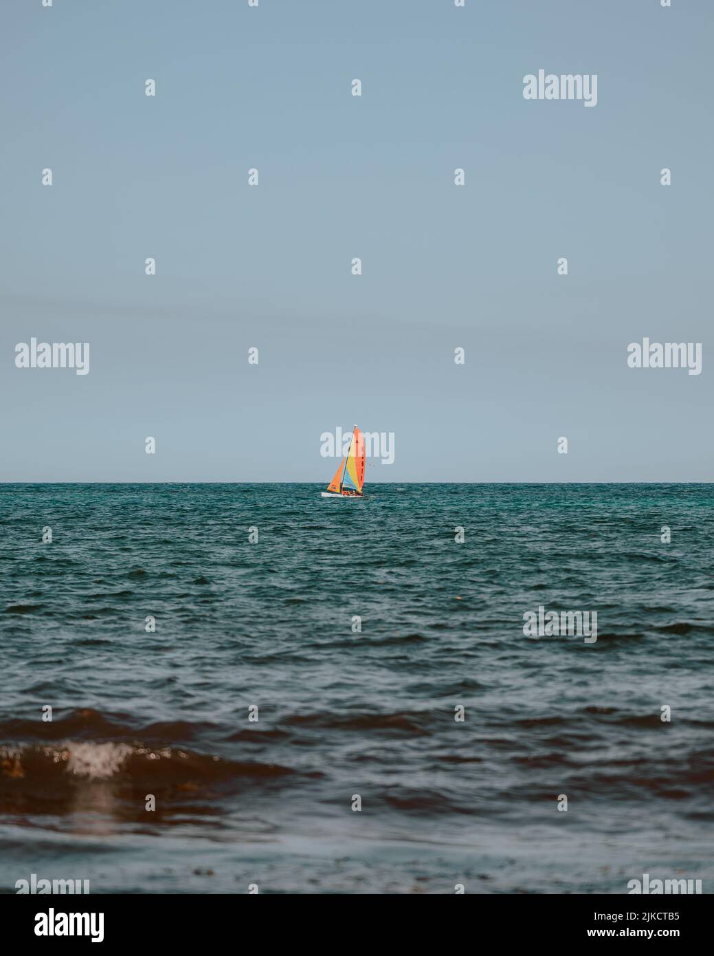 A vertical shot of a sailing boat in the ocean in Tulum, Mexico Stock ...