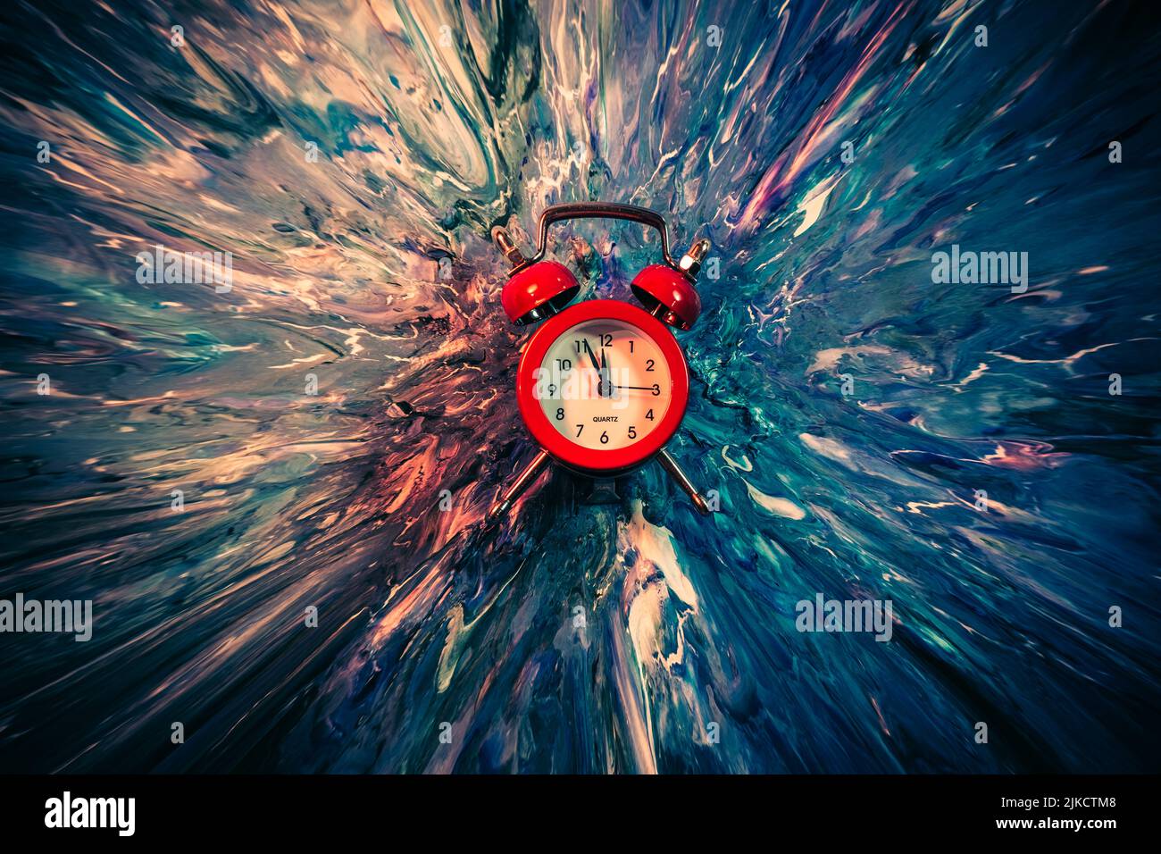 time travel red alarm clock smeared paint art Stock Photo - Alamy