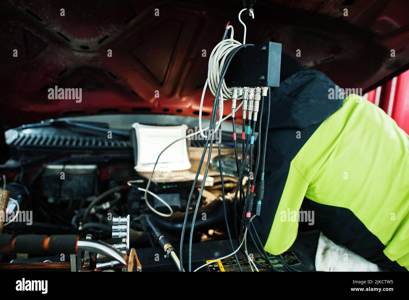 Auto mechanic sets american SUV car for diagnostics and configuration ...