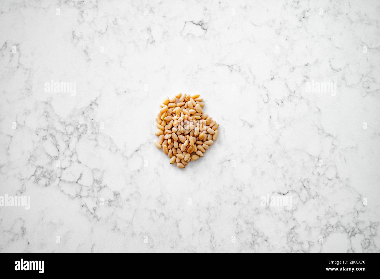 Ingredient show top down. Pine seeds, commonly used in pesto, salads ...