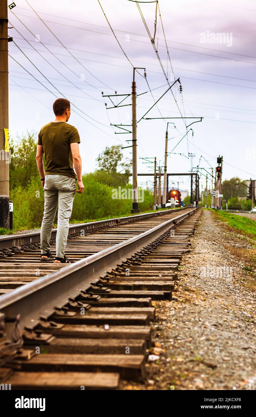 Silhouette man standing on railroad hi-res stock photography and images ...