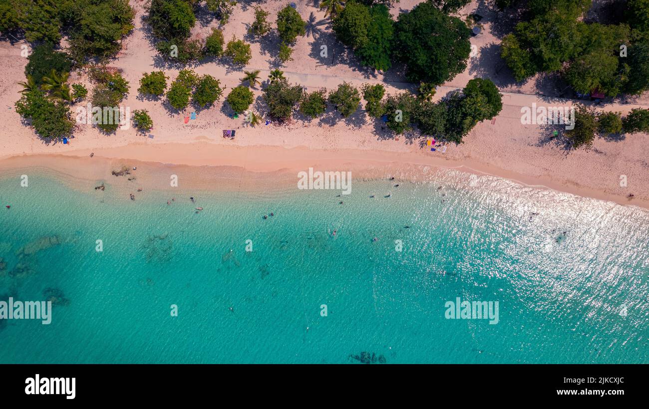 Mesmerizing aerial view of the calm turquoise sea, sandy beach and ...