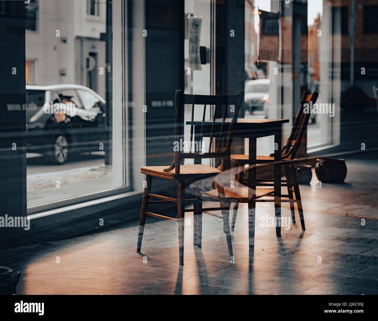 Empty room with to chairs facing out to the main street Stock Photo - Alamy