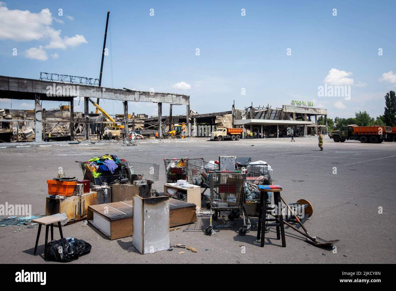Half burned shopping mall items are seen outside the destroyed Shopping ...