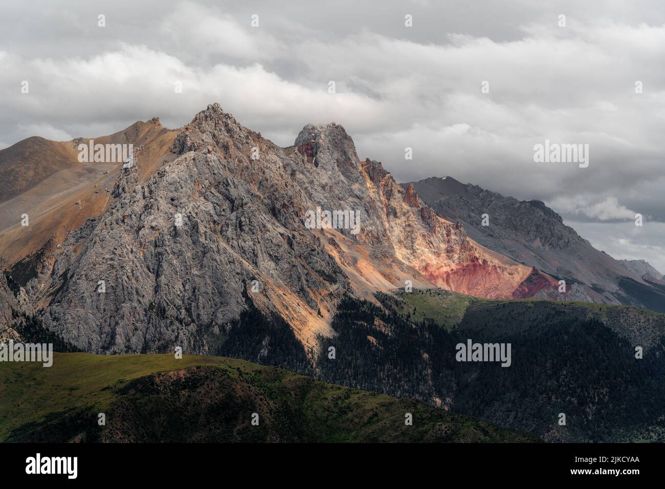 A mountain without vegetation with a dark clouds on the dark horizon ...