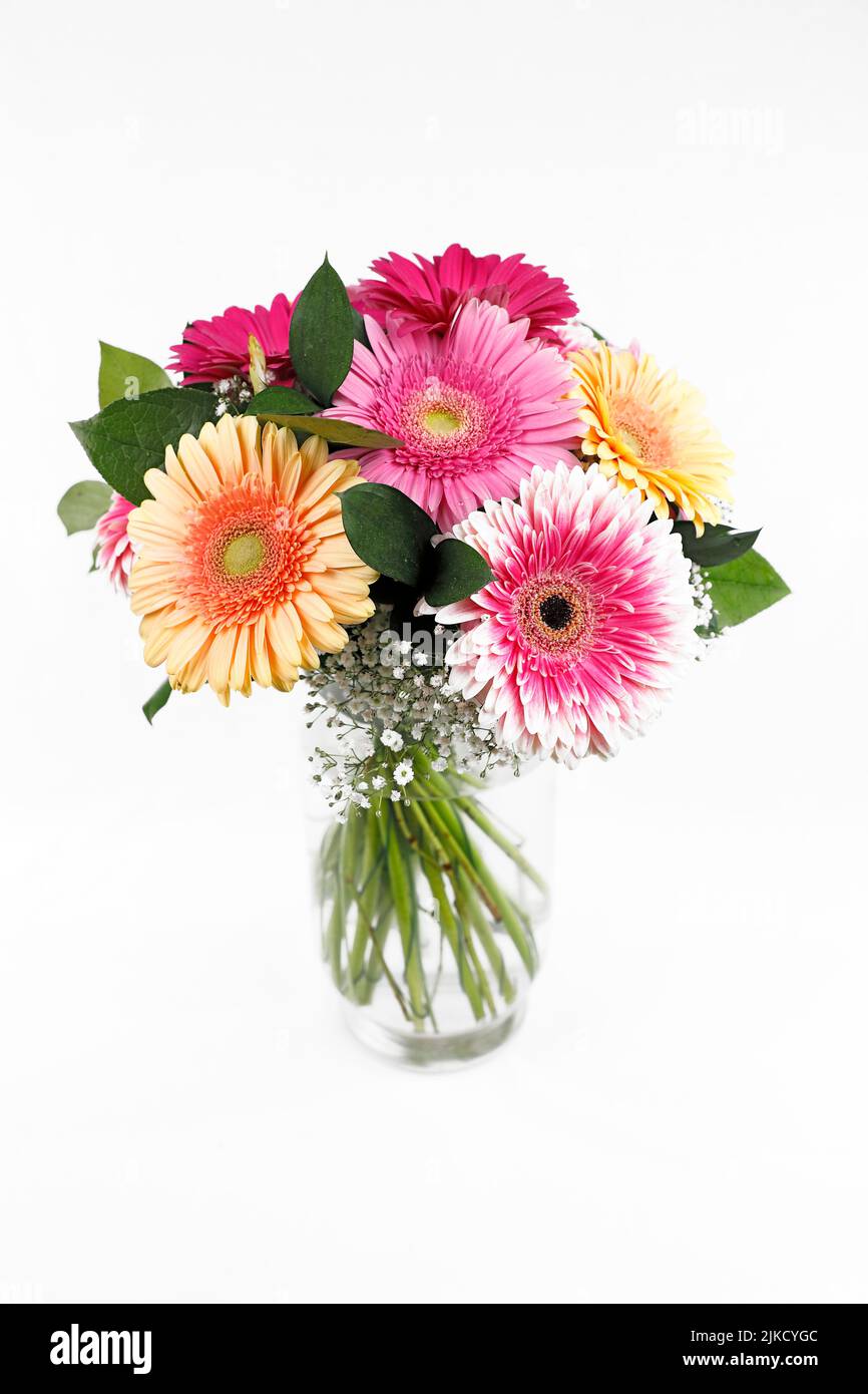 A colourful bouquet with Gerberas in a glass vase Stock Photo - Alamy