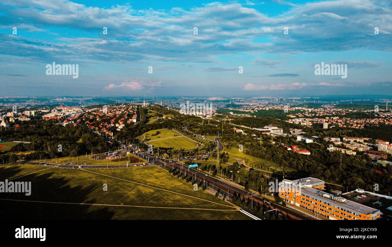 An aerial view of modern buildings surrounded by trees in Prague, Czech ...
