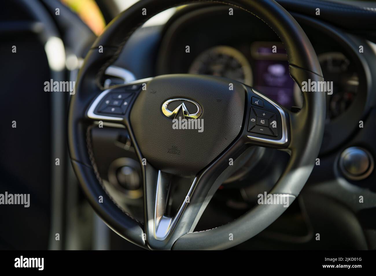 The Infinity interior with the black steering wheel with logo Stock ...