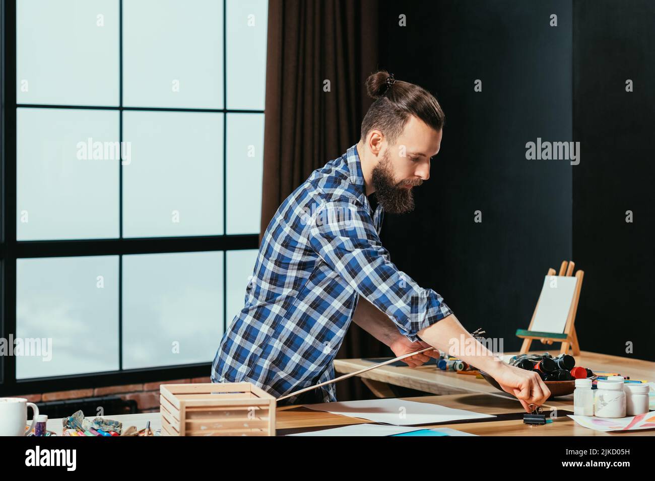 artist workplace bearded painter tools inspiration Stock Photo - Alamy