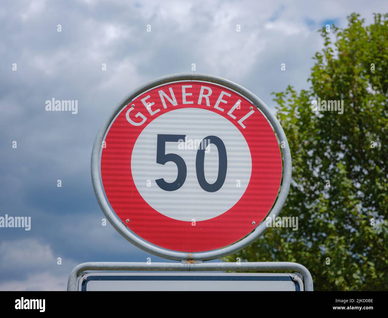 The road speed sign , village background. Speed limit sign in the ...