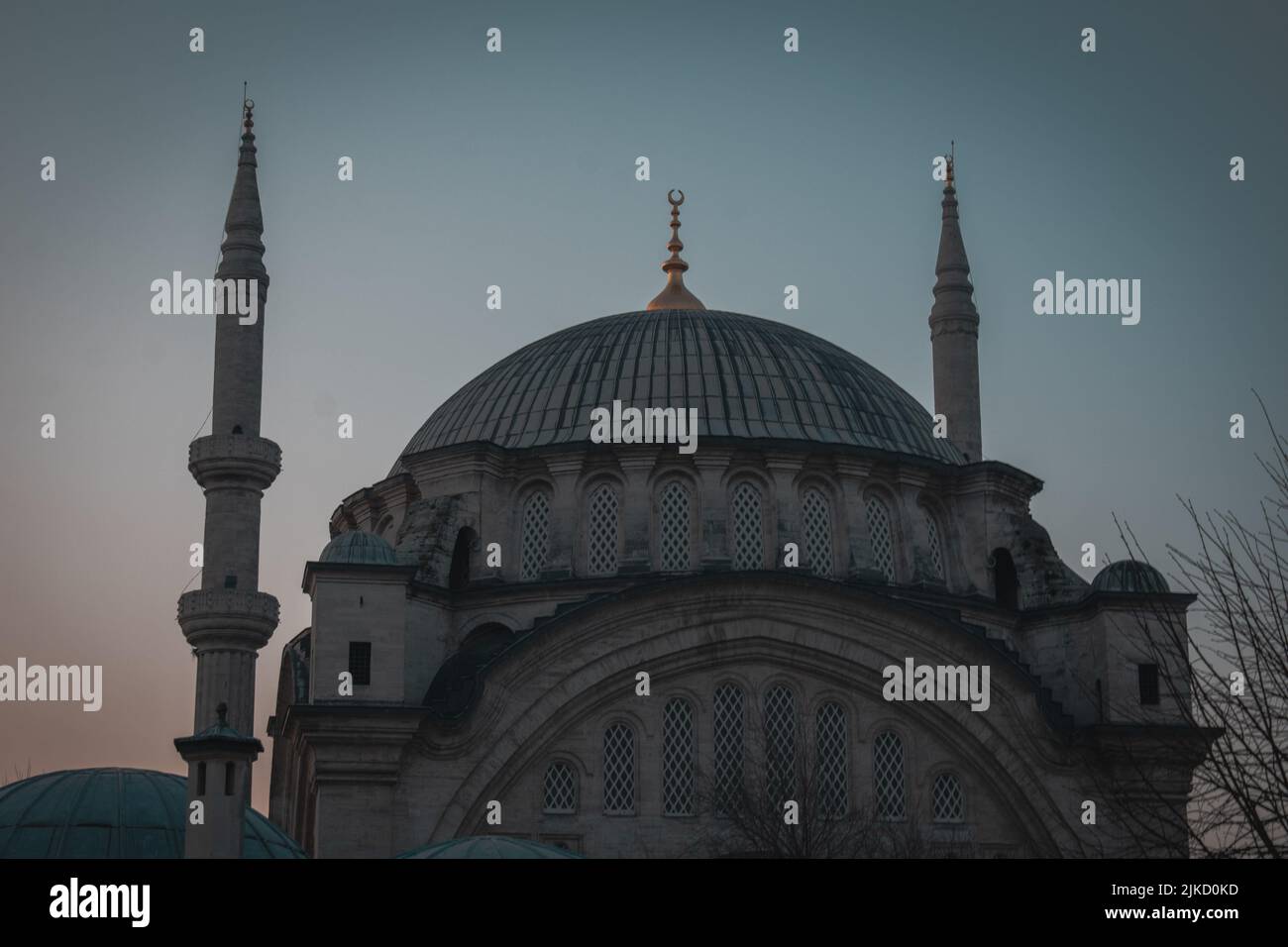 A scenic view of the Nuruosmaniye Mosque during sunset, in Istanbul ...