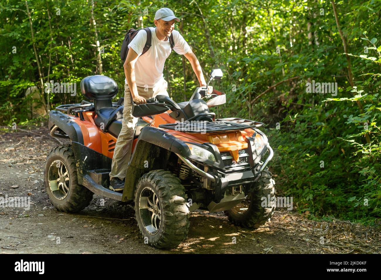 Young man driving off road adventure with happy and smiling. Man riding ...