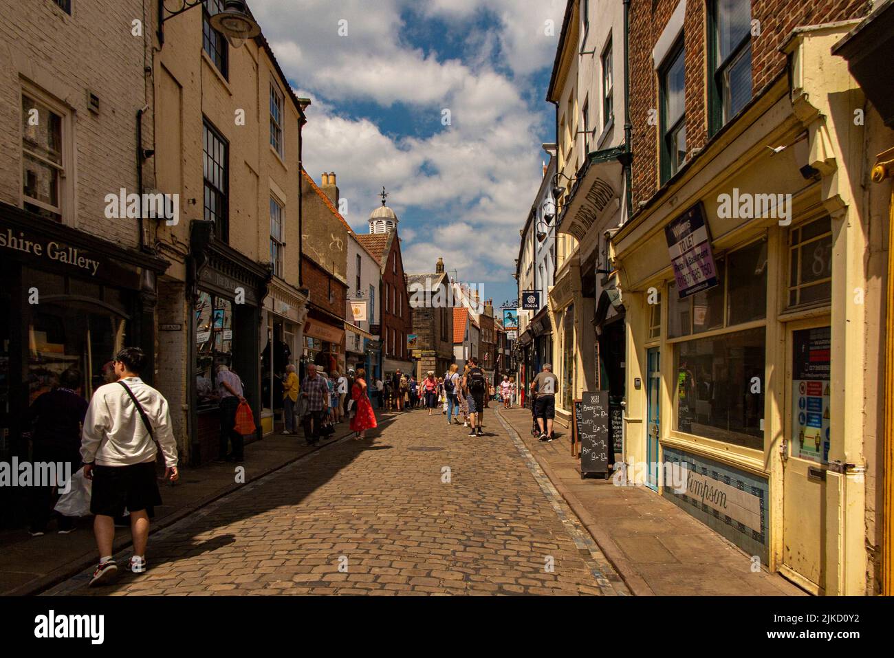 Narrow cobbled streets in Whitby, a popular holiday destination in ...
