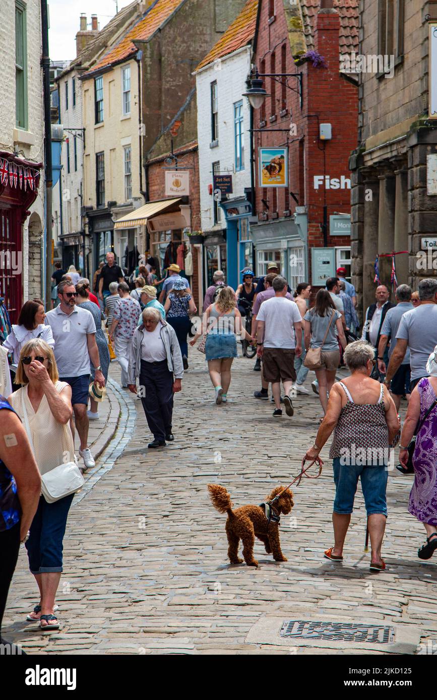 High summer in Whitby and crowds gather in the shopping streets Stock ...
