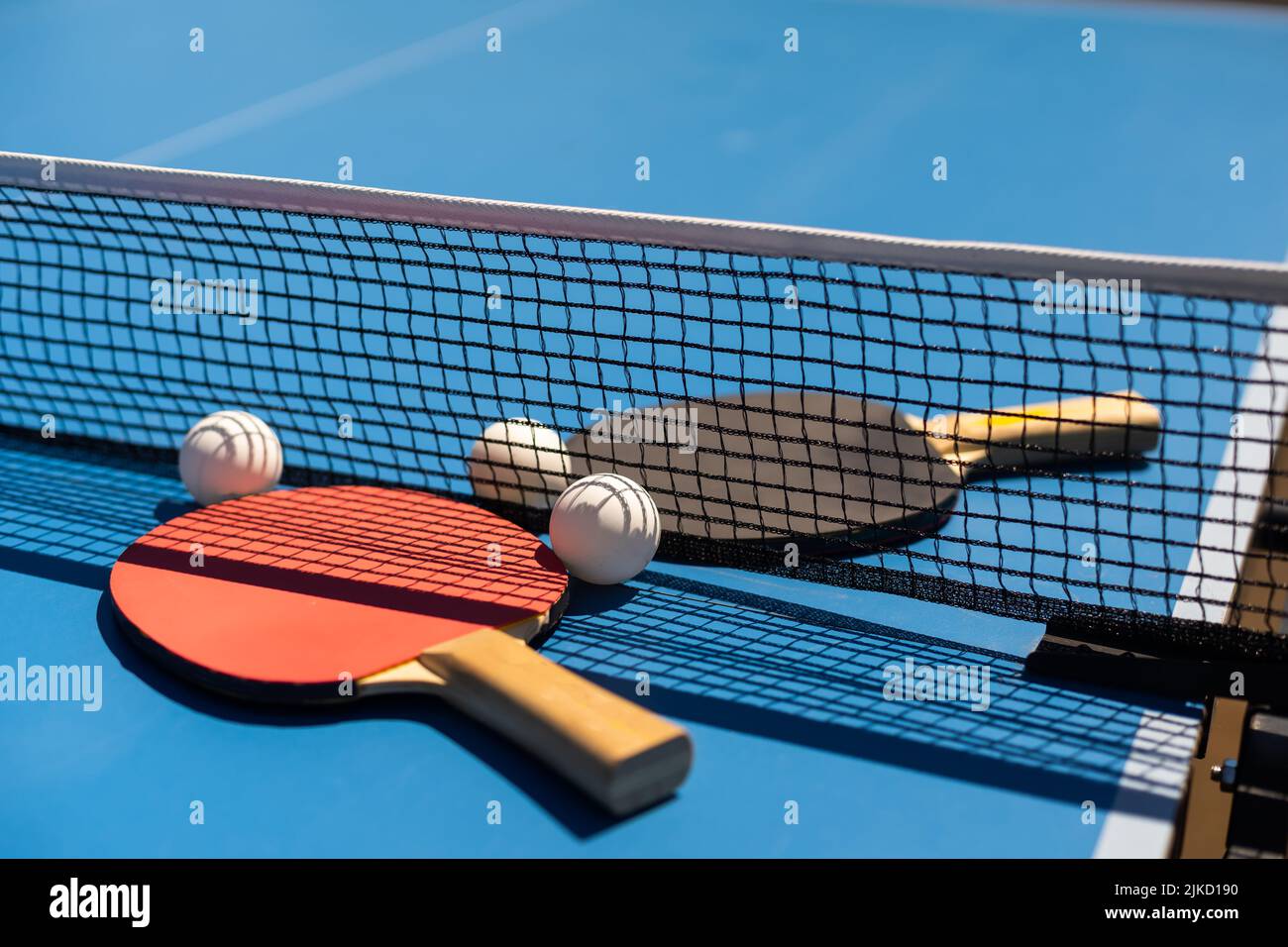 Ping pong table, rackets and balls in a sport hall Stock Photo - Alamy