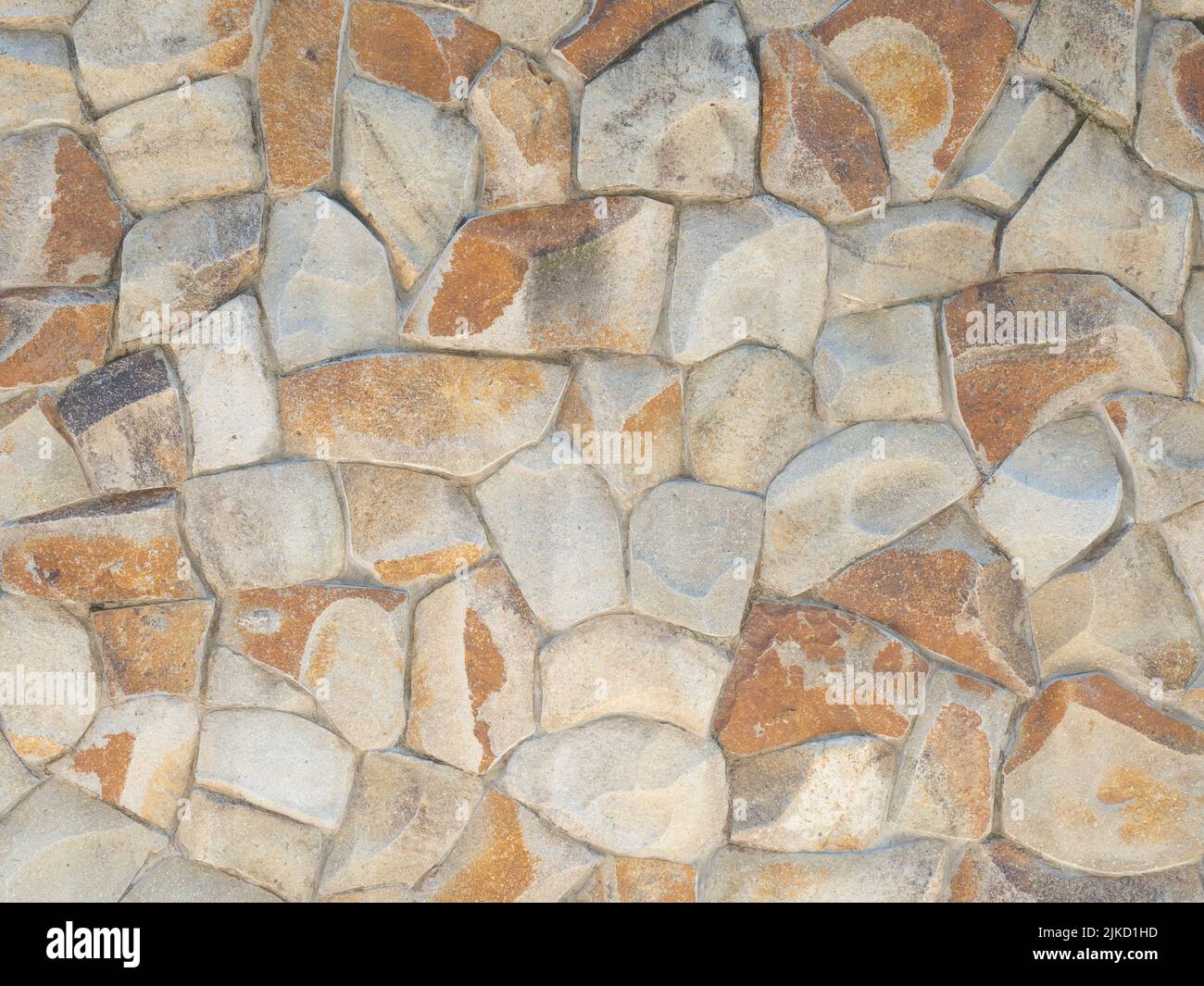 Wall cladding with coarse decorative spotted red stone. Not a seamless ...