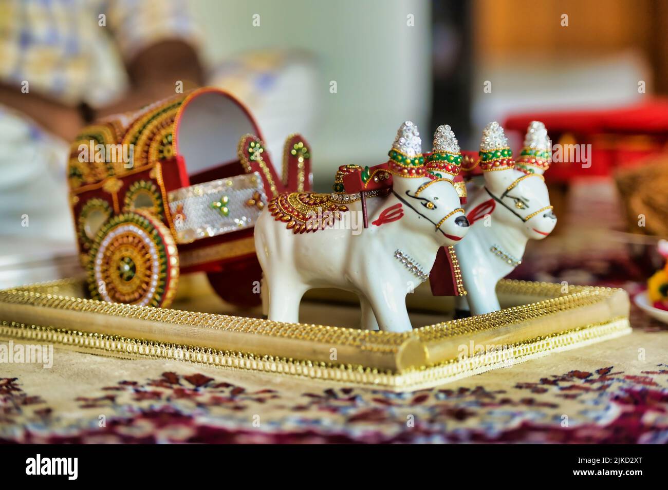 A ceramic statue of traditional Indian bull cart on a table Stock Photo ...