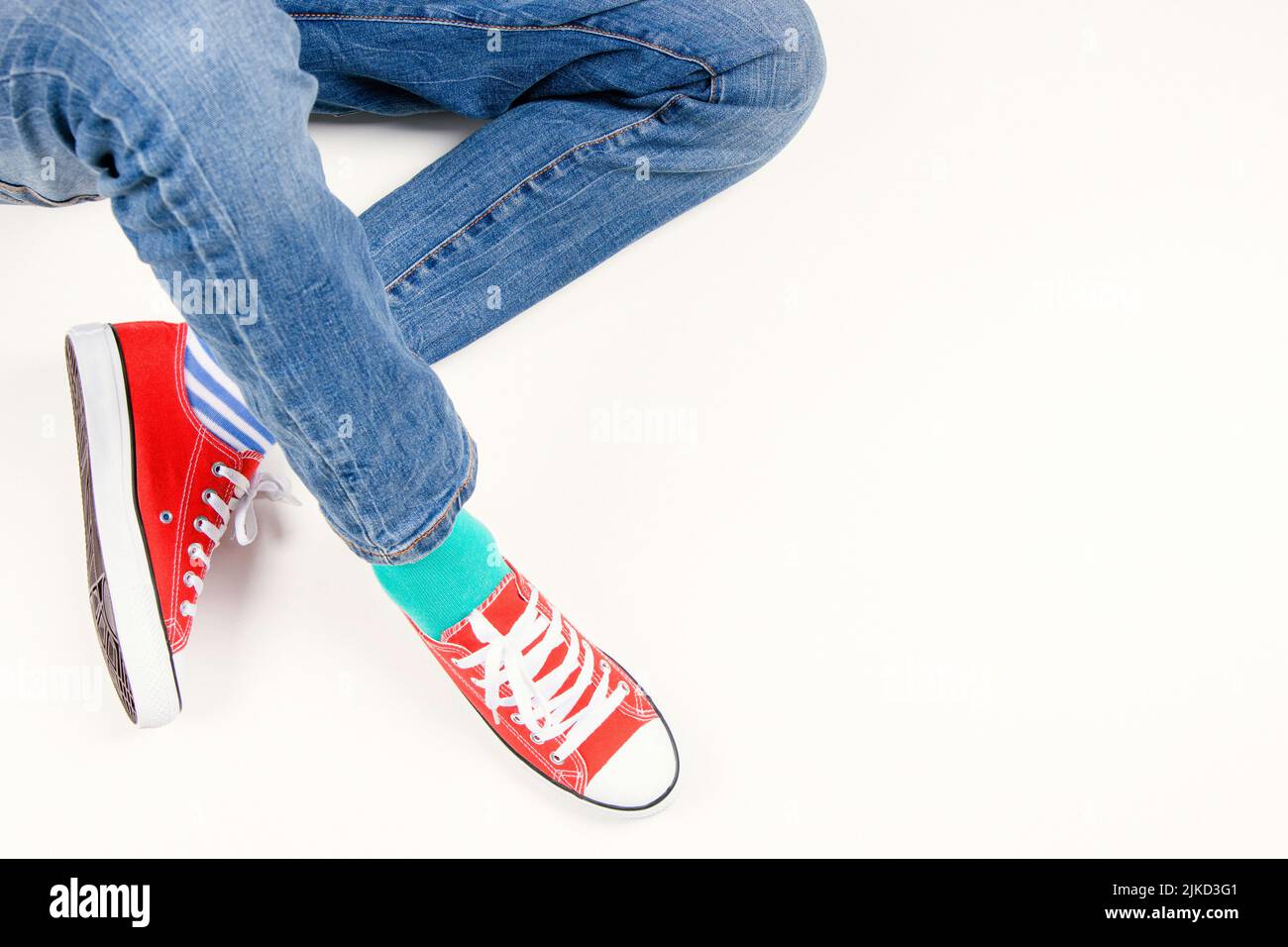 Kid wearing different pair of socks. Child foots in mismatched socks ...