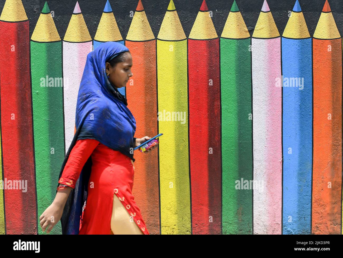 Mumbai, India. 01st Aug, 2022. A woman holding a phone in her hand ...