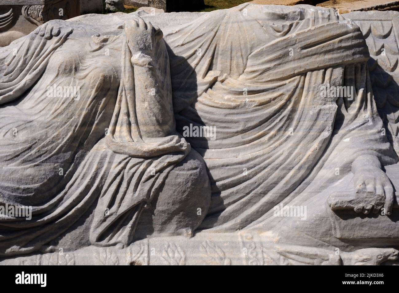 A Roman man places a hand on his wife's shoulder. Sculpted reclining ...