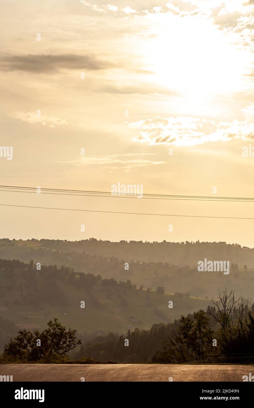 Scenic sunset yellow sunlight countryside villages landscape, horizon ...