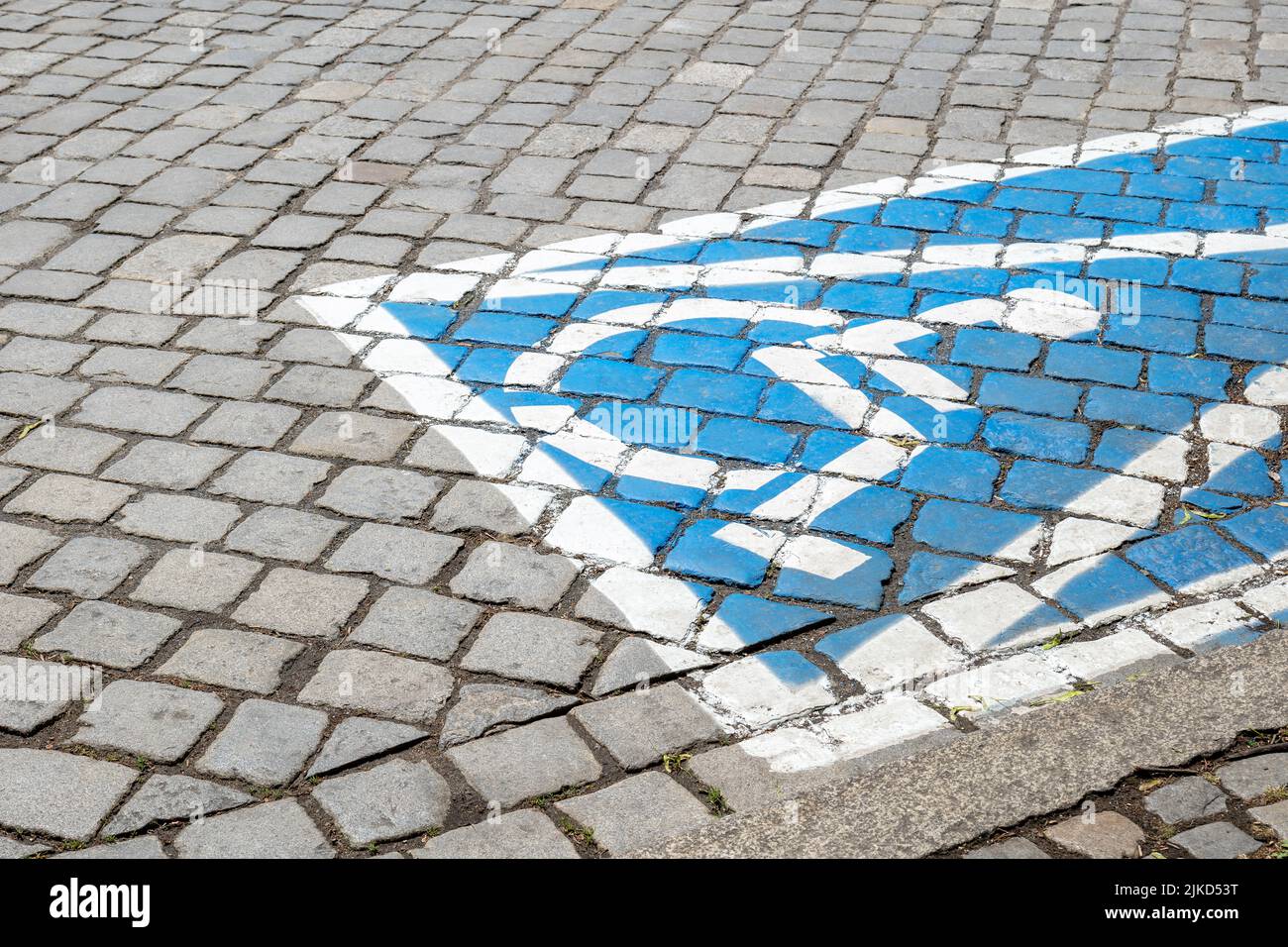 One single blue marked parking spot for the disabled, outdoors pavement ...