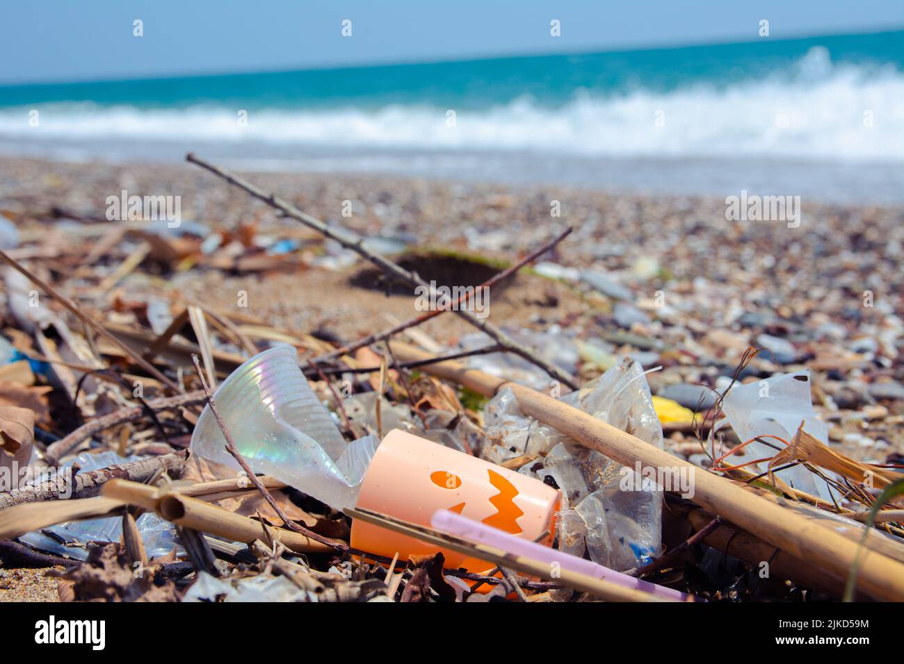 Garbage on the sea beach. A man-made garbage in the sea: plastic ...