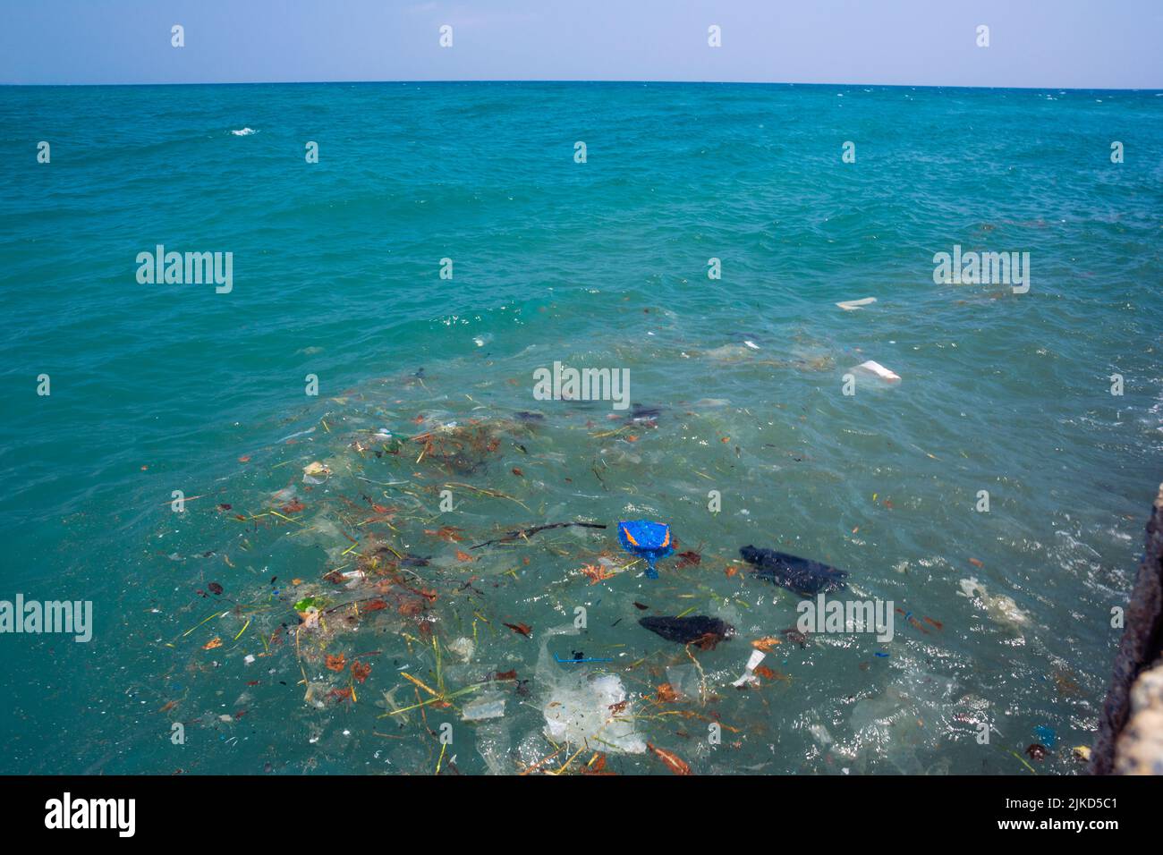 Garbage floats in the sea. An island of man-made garbage in the sea ...