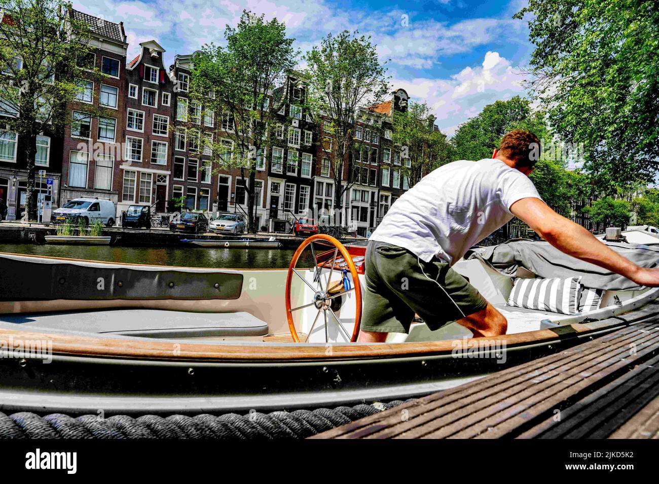 Amsterdam, Netherlands. 20th July, 2022. A man in the boat with a view ...