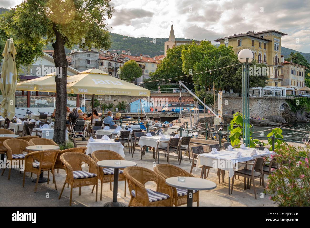 View of cafe and restaurant, harbour over looked by St George's Church ...