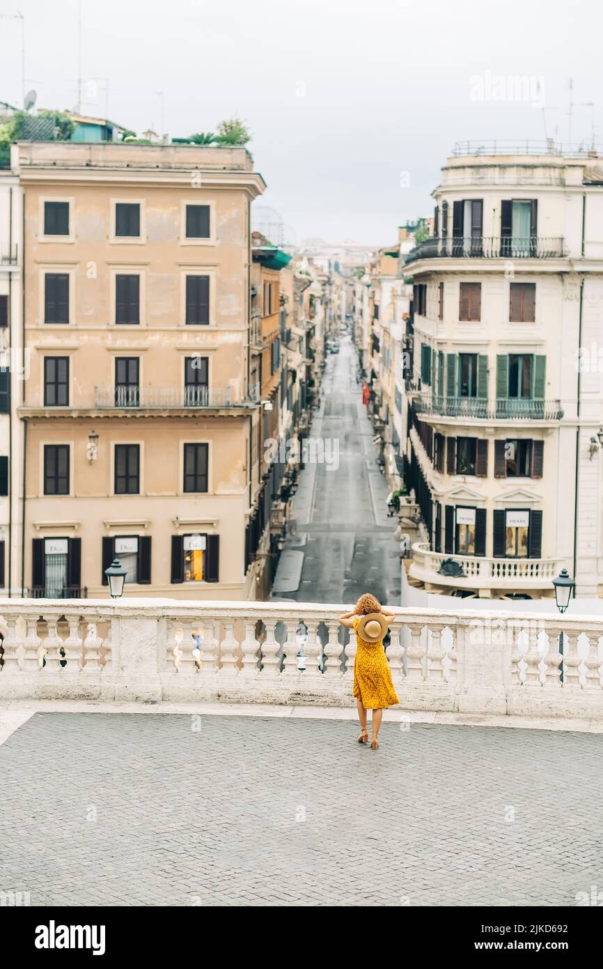 Rome Italia travel concept. A tanned young woman walks overlooking Rome ...