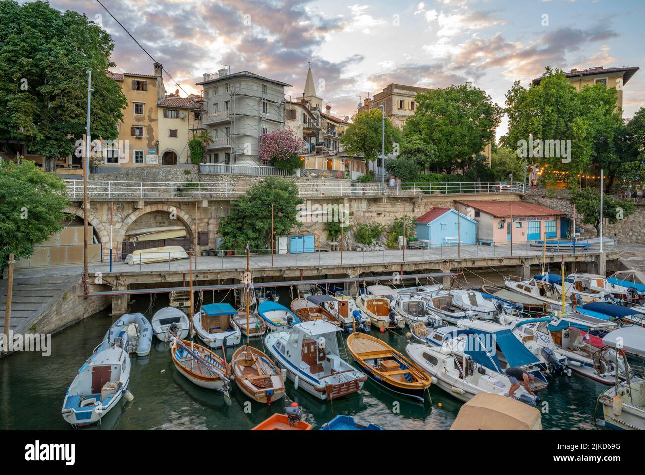 View of cafe and restaurant, harbour over looked by St George's Church ...