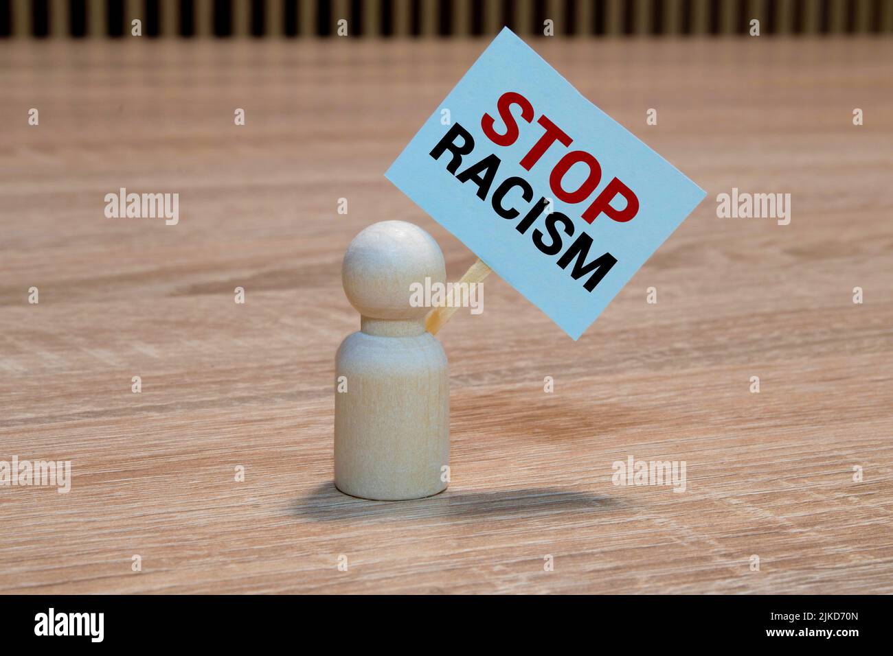 Black and white figures of people on a black background. The ...