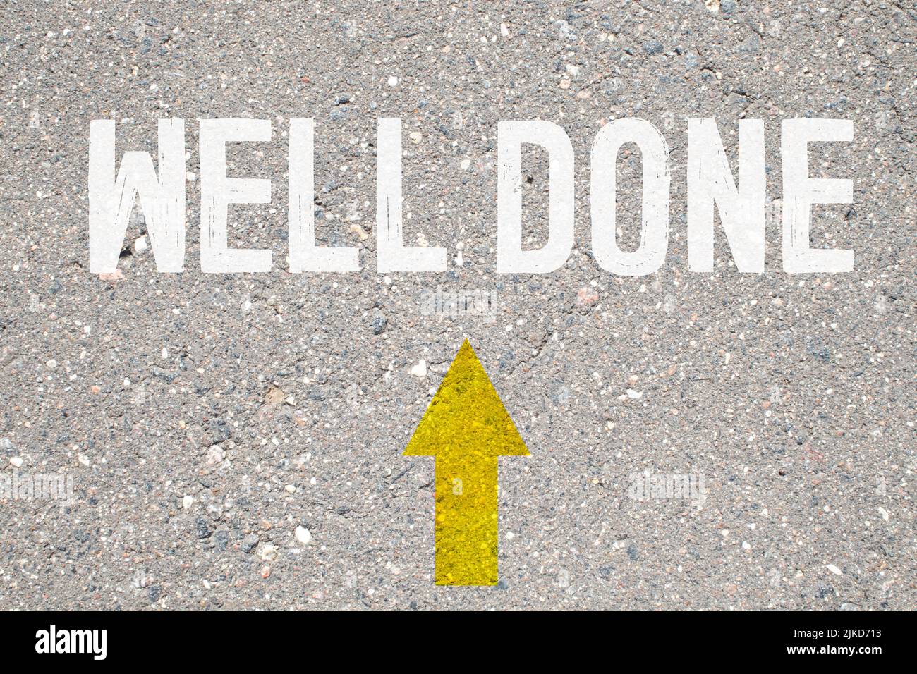 Business concept. On the asphalt road markings an arrow with the ...