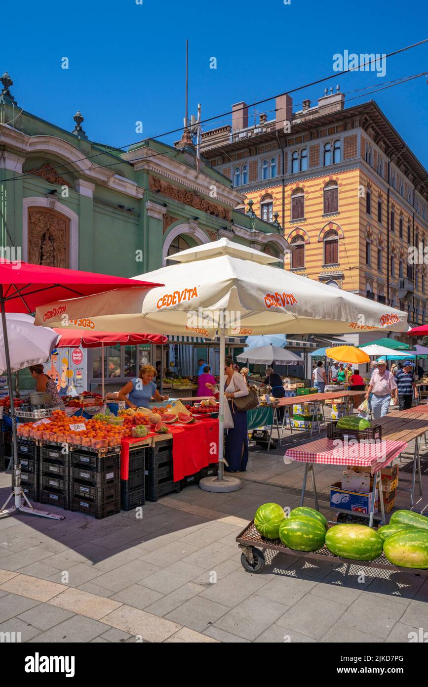 View of fruit and vegetable stall and exterior of ornate Central Market ...
