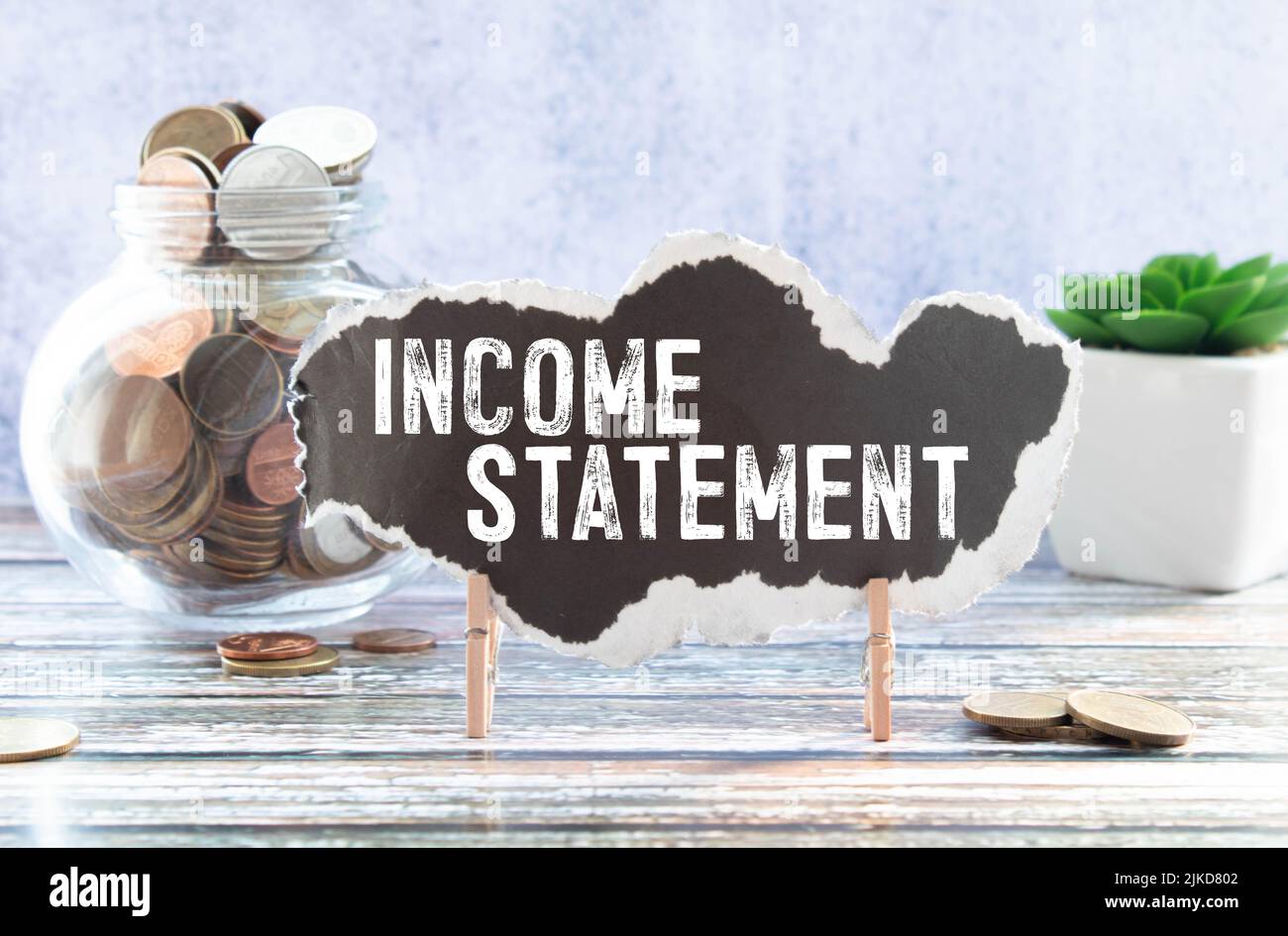 income statement, the text is printed on a piece of paper torn from a ...