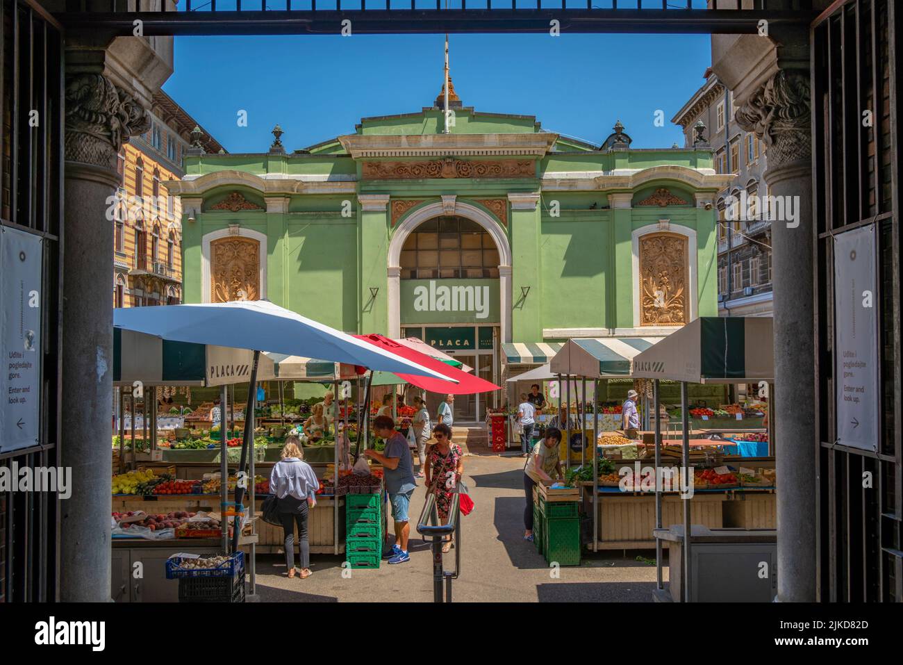 View of fruit and vegetable stall and exterior of ornate Central Market ...
