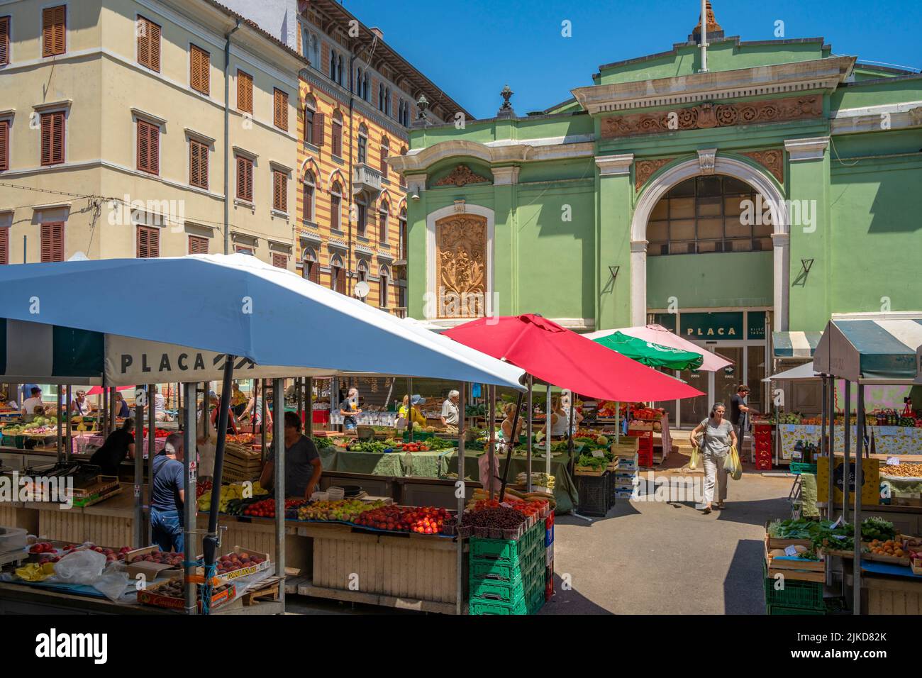 View of fruit and vegetable stall and exterior of ornate Central Market ...
